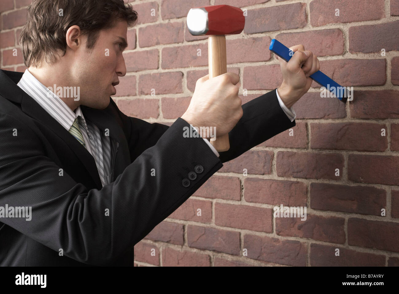 Hammer breaking a rock hi-res stock photography and images - Alamy