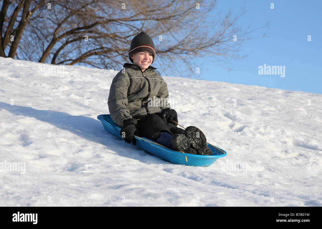 Sliding down snow slope hi-res stock photography and images - Alamy