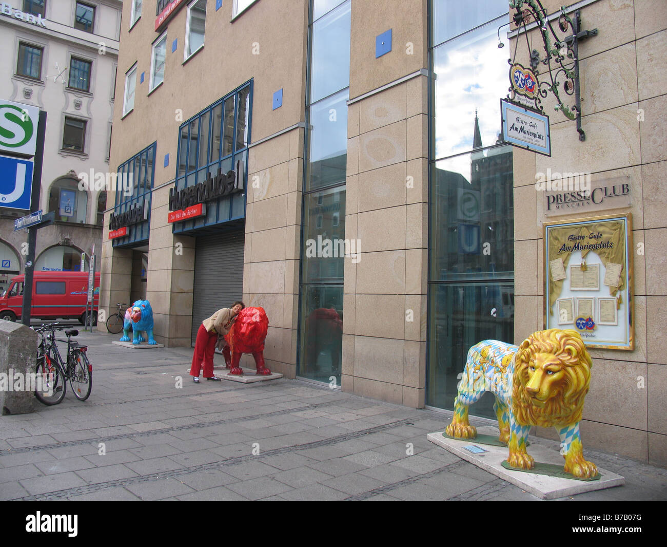 Square at Munich, Germany, with trees and sculptures Stock Photo - Alamy