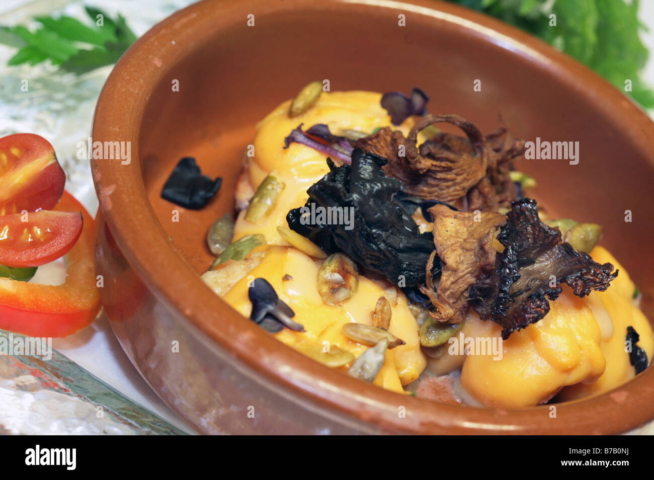 fish with nuts and mushrooms tapas Stock Photo - Alamy
