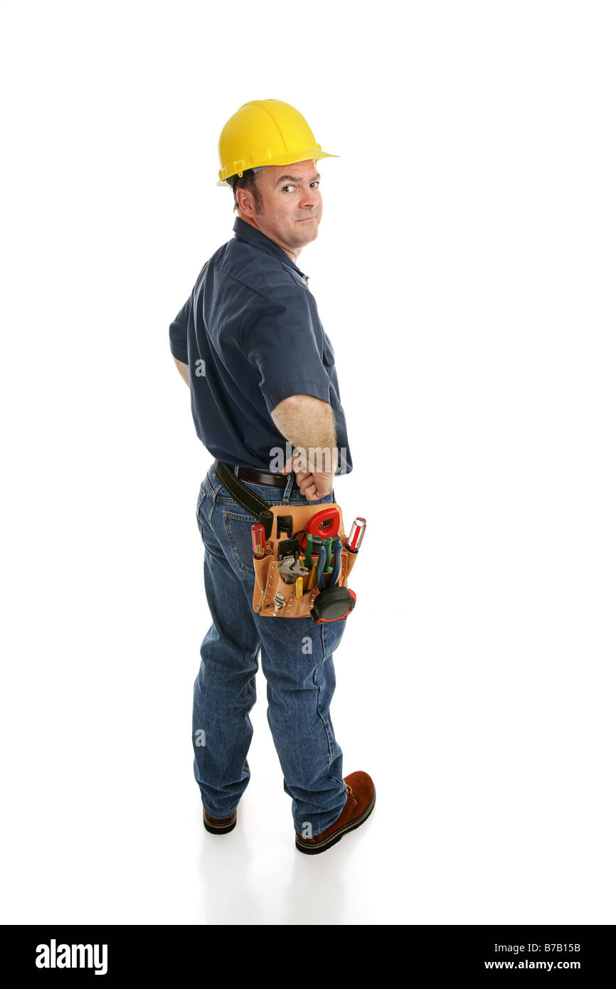 Side view of a construction worker looking over his shoulder Full body ...