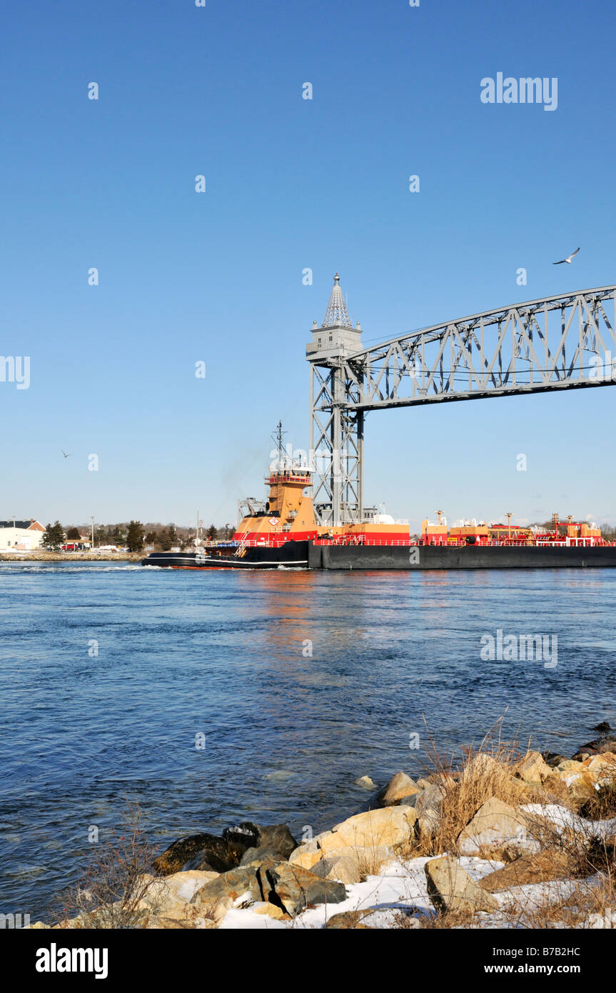 Tugboat and barge in Cape Cod Canal Passing UnderRailroad Bridge USA ...