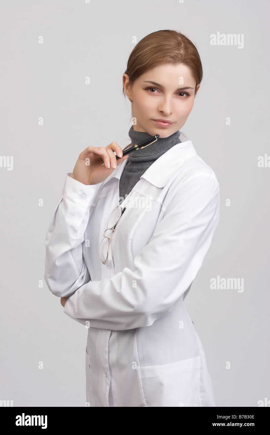 Young beautiful doctor on the white background Stock Photo - Alamy