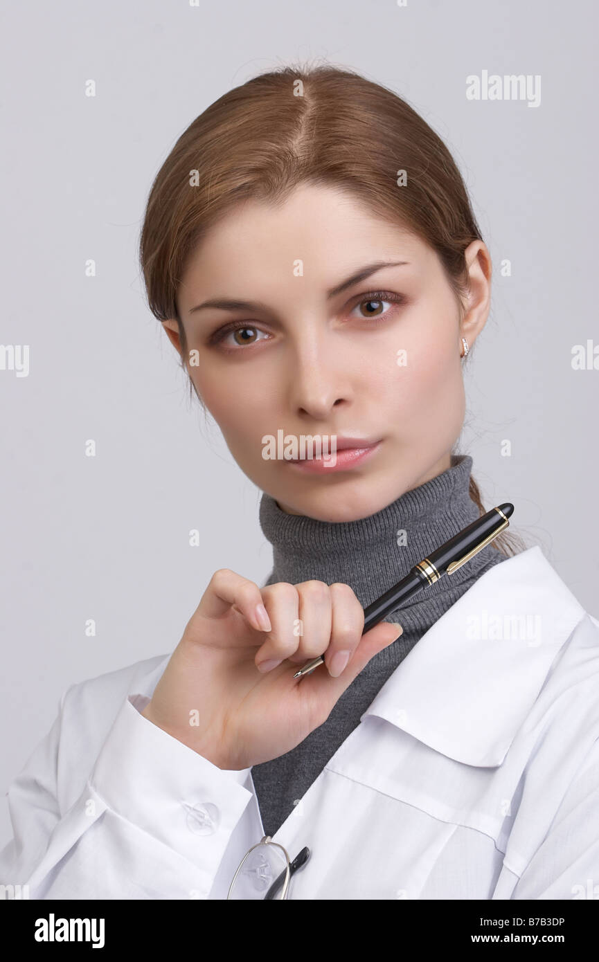Young beautiful doctor on the white background Stock Photo - Alamy
