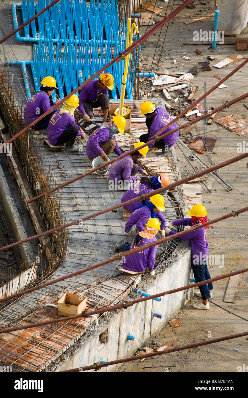 Building Site, A Uniformed Asian work gang on Reinforced concrete ...