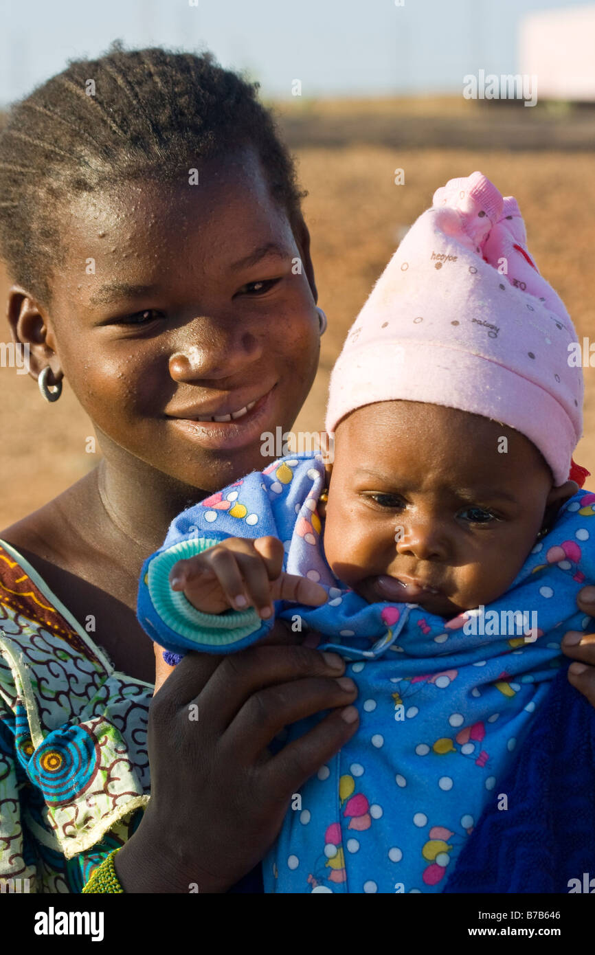 Young Malian mother hjolding baby in Diboli Mali Stock Photo - Alamy