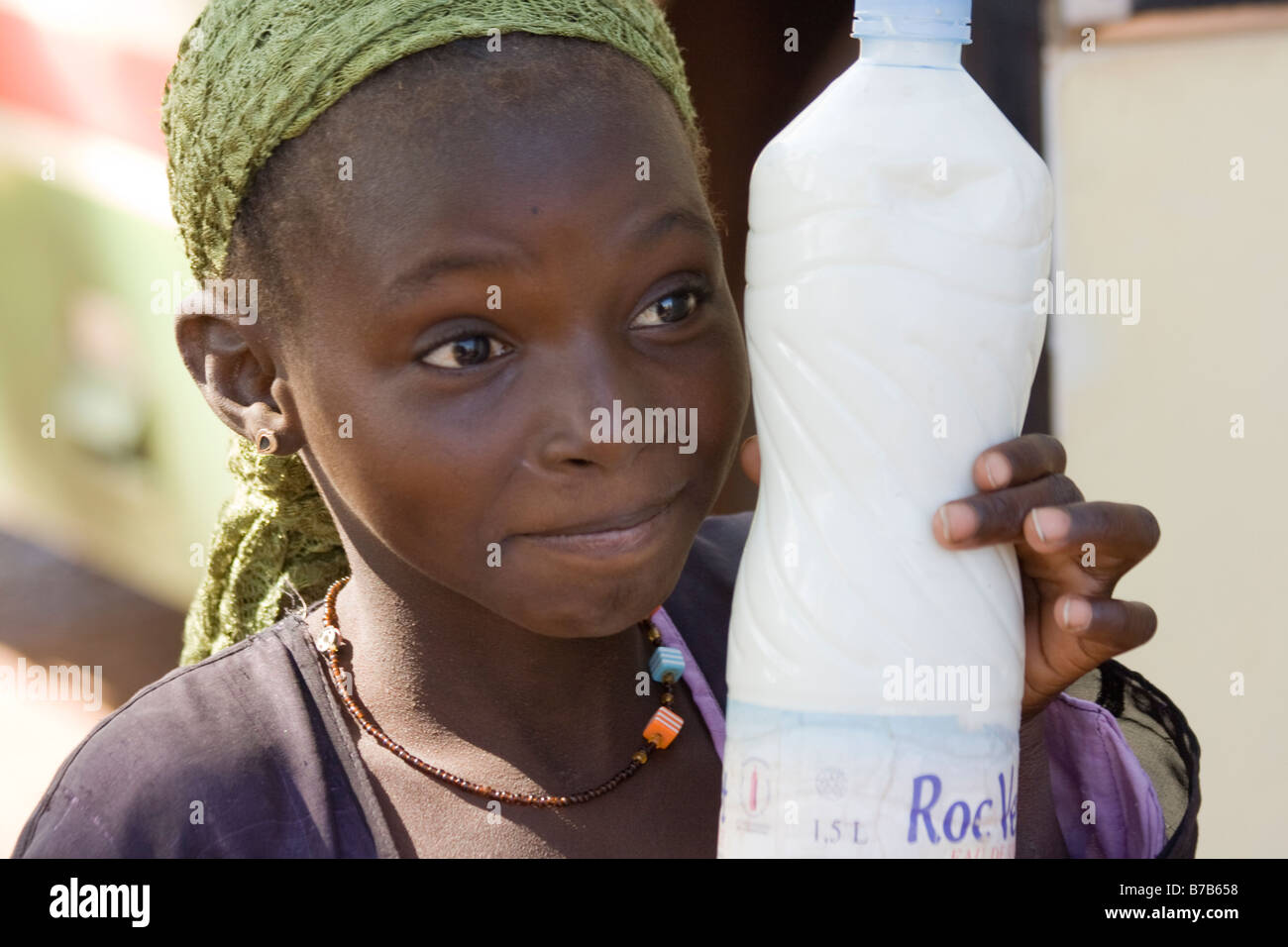 Malian Girl Selling Fresh Milk in a Water Bottle in Bamako Mali Stock ...
