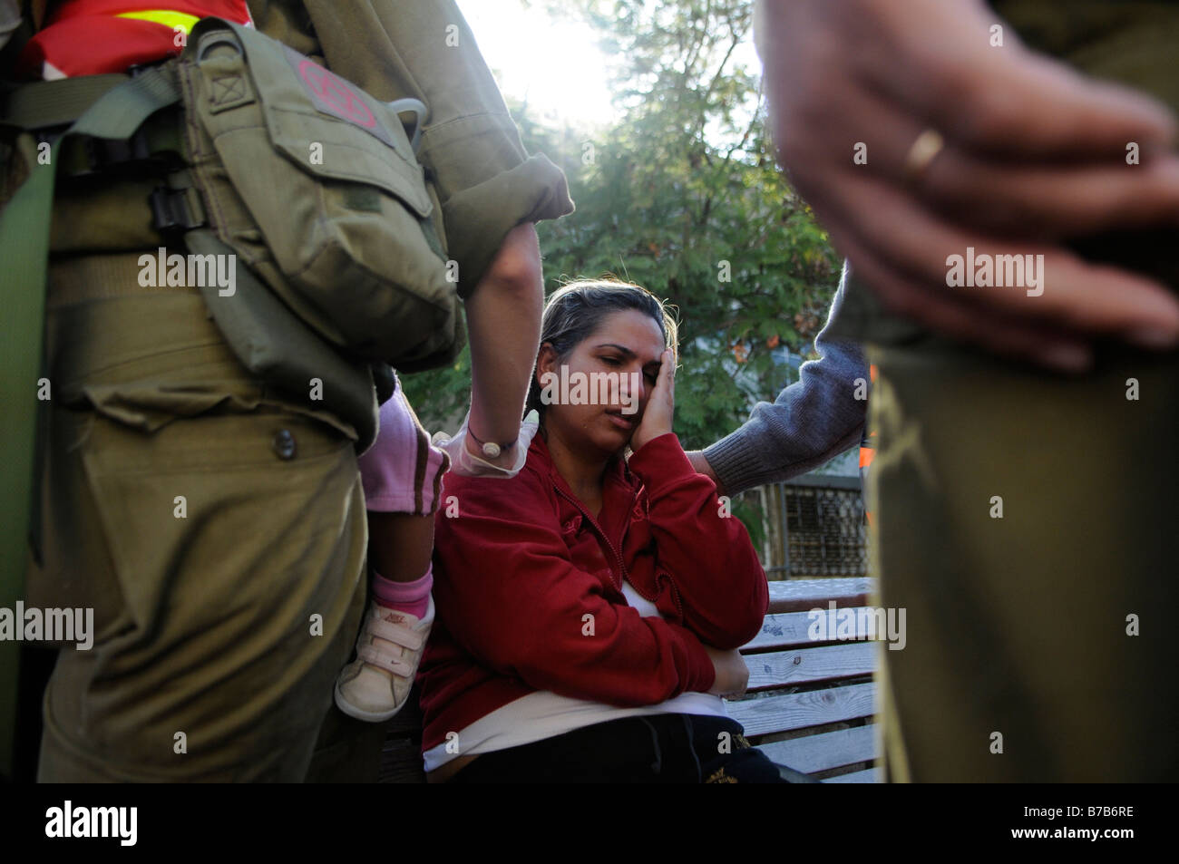 Israeli military medics treat an Israeli civilian in shock after ...