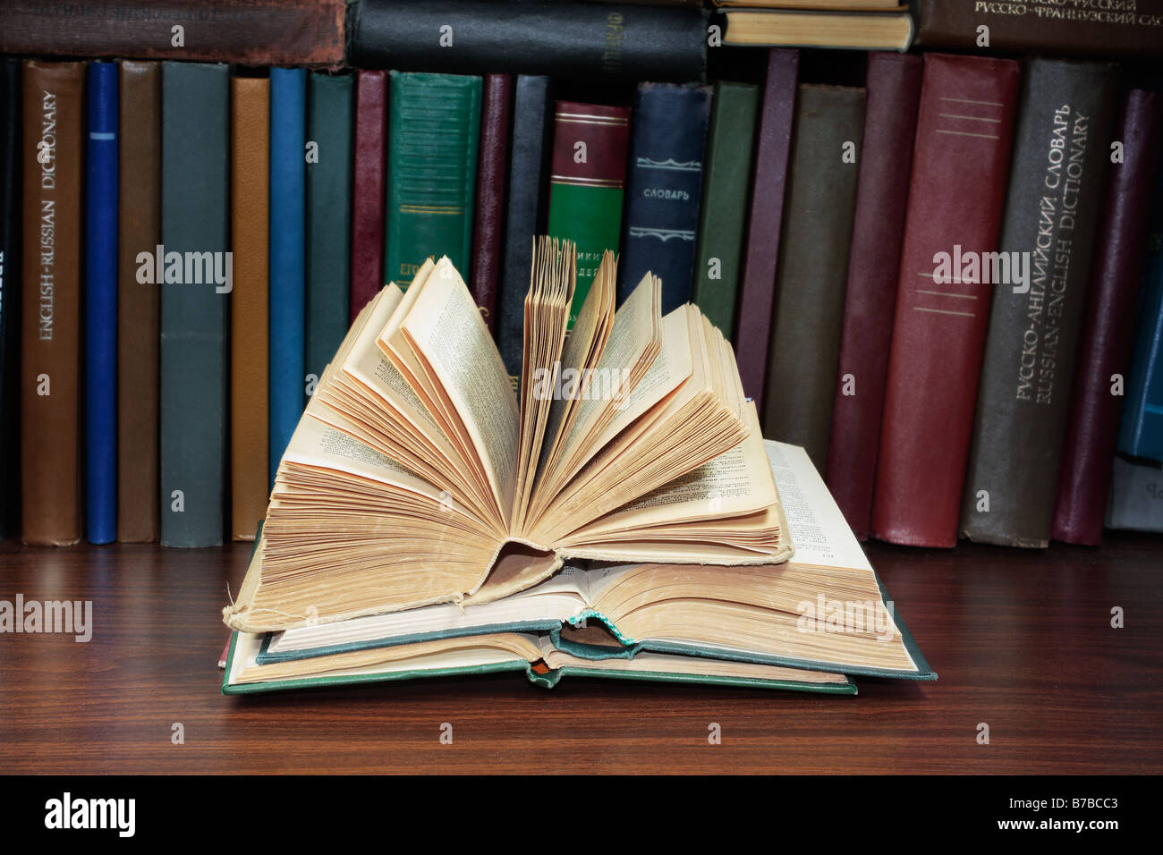 Open books on the writing-table Stock Photo - Alamy