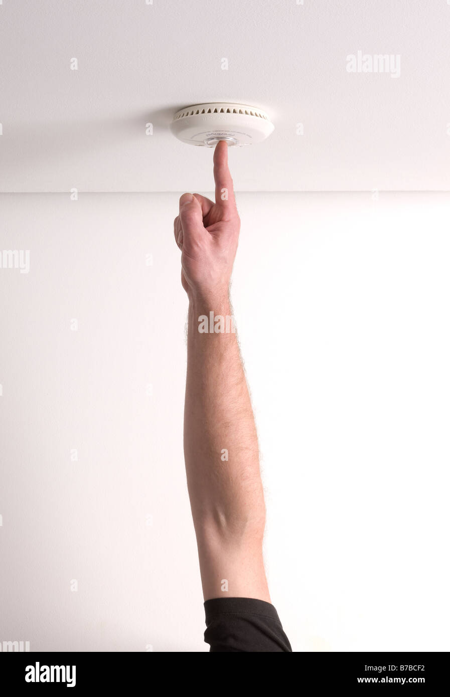 Man testing domestic fire alarm hi-res stock photography and images - Alamy