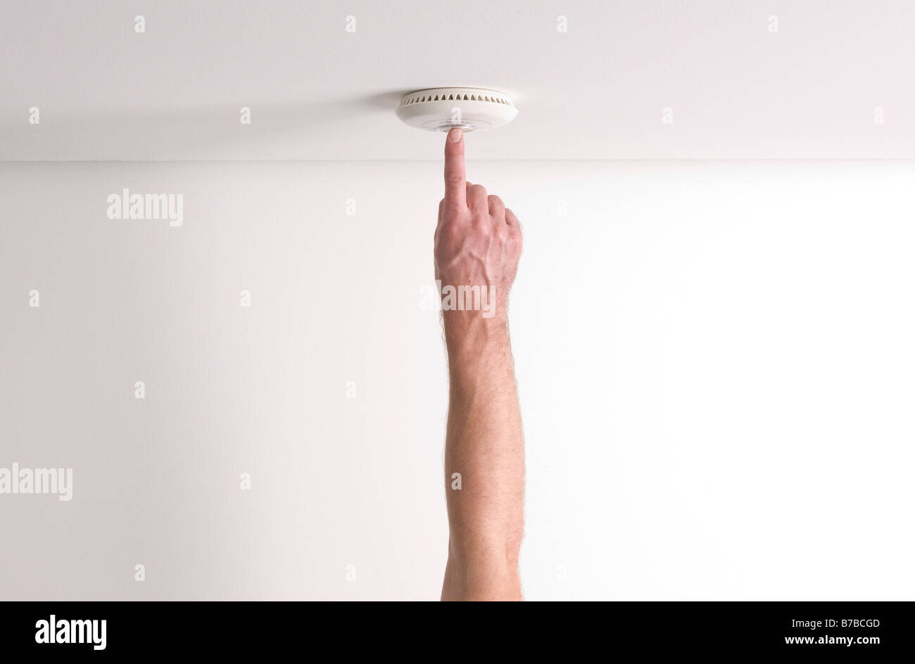 Man testing domestic fire alarm hi-res stock photography and images - Alamy