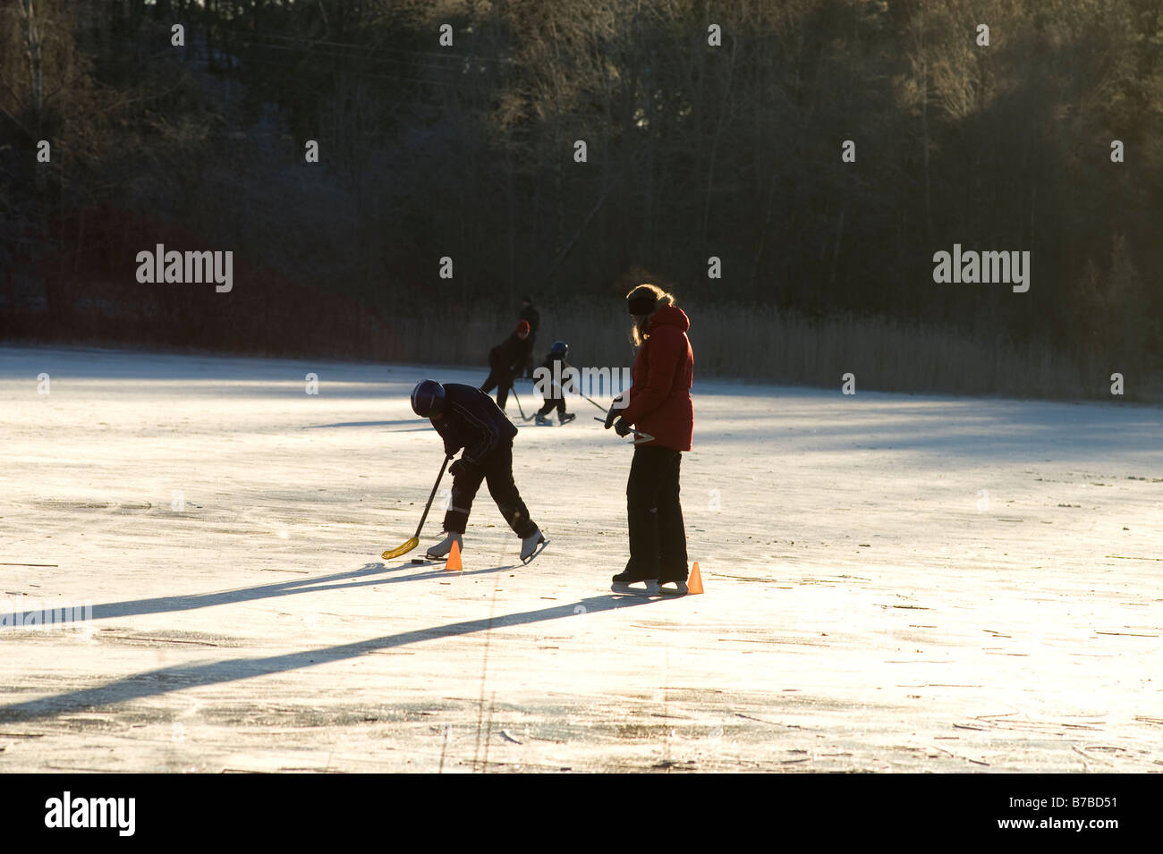 Ice skating on a lake in Sweden Stock Photo - Alamy