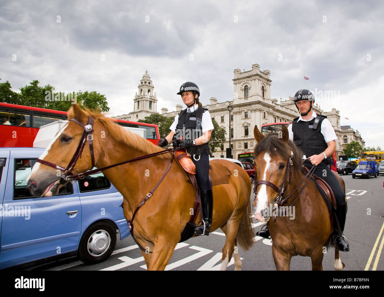 Two Police Officers mounted on horses in Parliament Square London ...