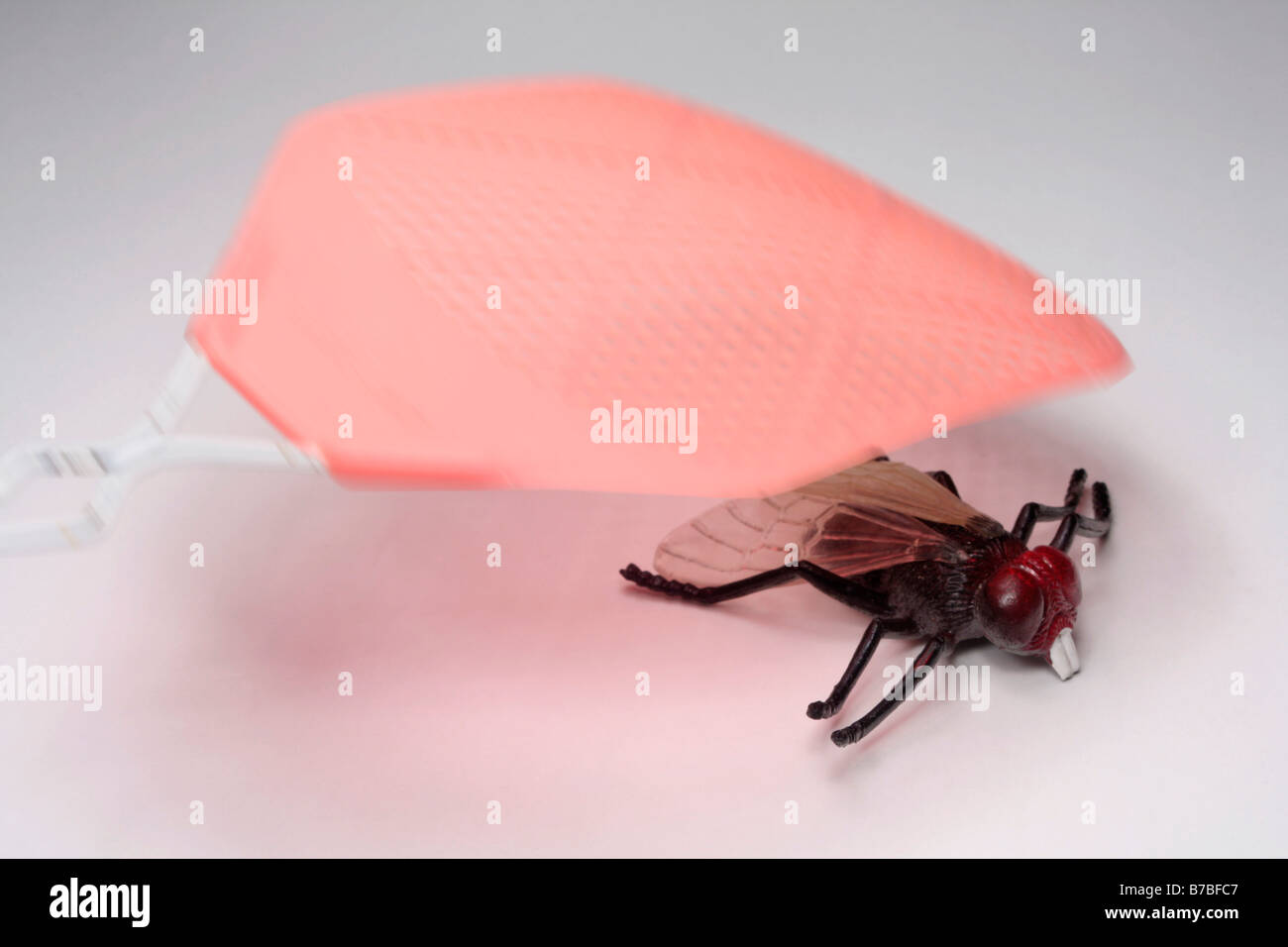 Swatting a BIG fly (fake Stock Photo - Alamy