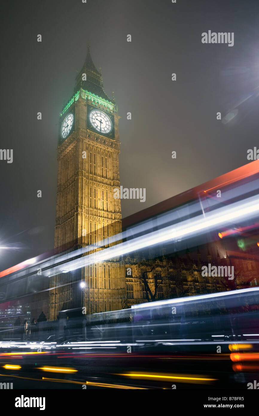 Big Ben clocktower at night in the fog with traffic light trails ...