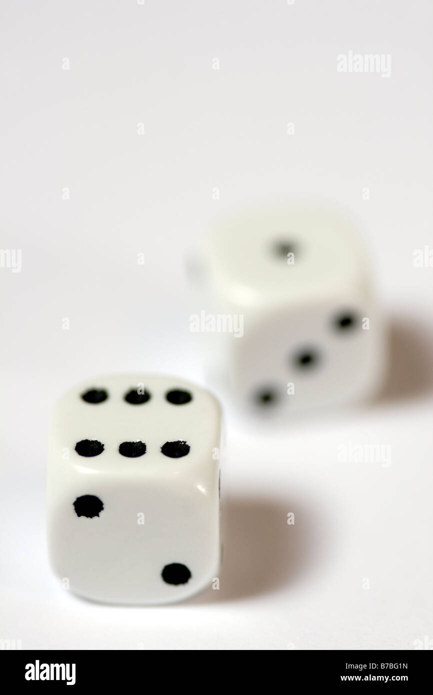 Two dice rolled six and one close up Stock Photo - Alamy