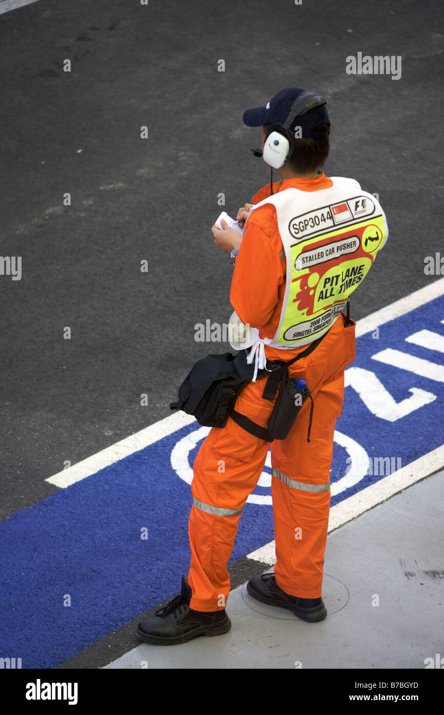 Singapore F1 track pit lane marshal Stock Photo - Alamy