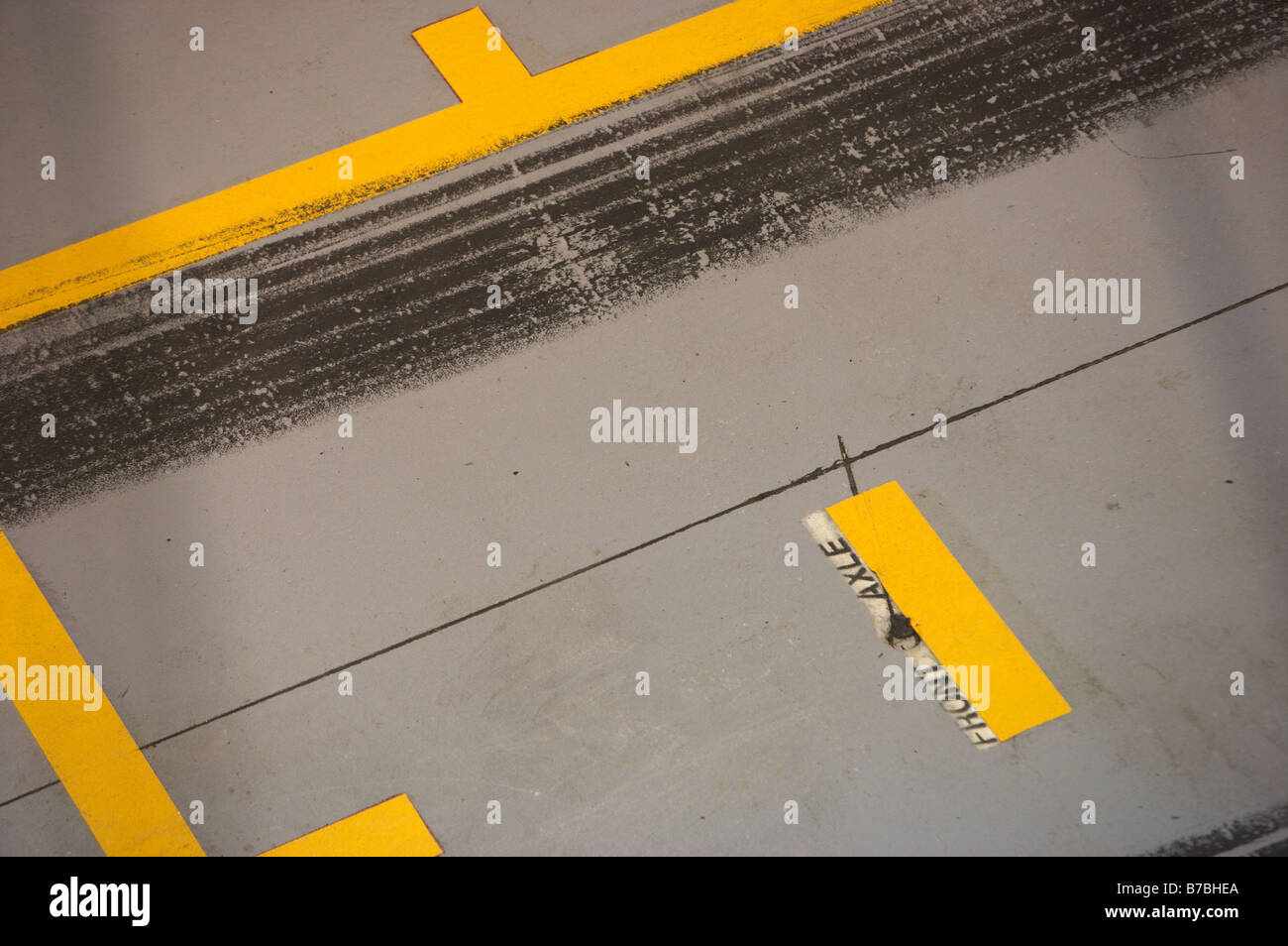Pit lane box tire marks Stock Photo - Alamy