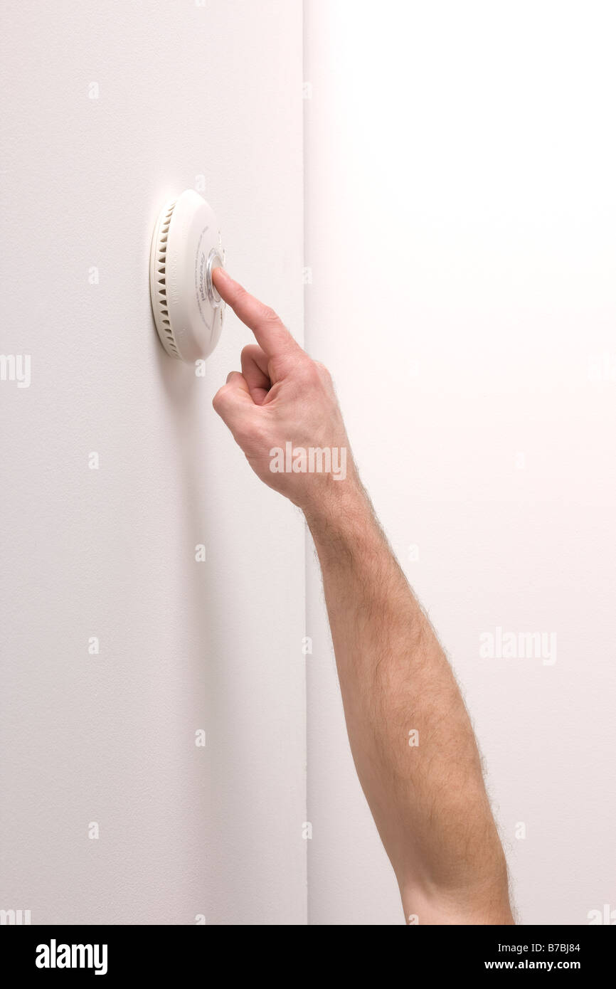 Man testing domestic fire alarm hi-res stock photography and images - Alamy