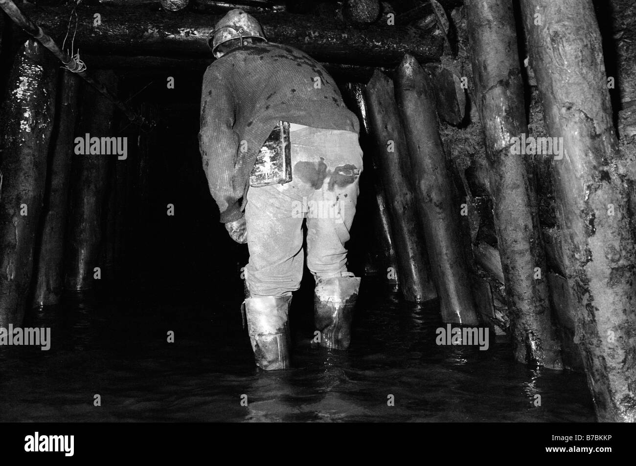 Miner in flooded roadway underground at Blaencuffin coal mine a ...