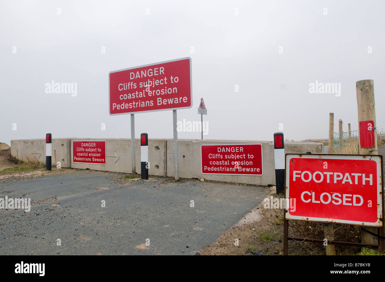 Signs warning of danger because of coastal erosion at Ulrome, East ...