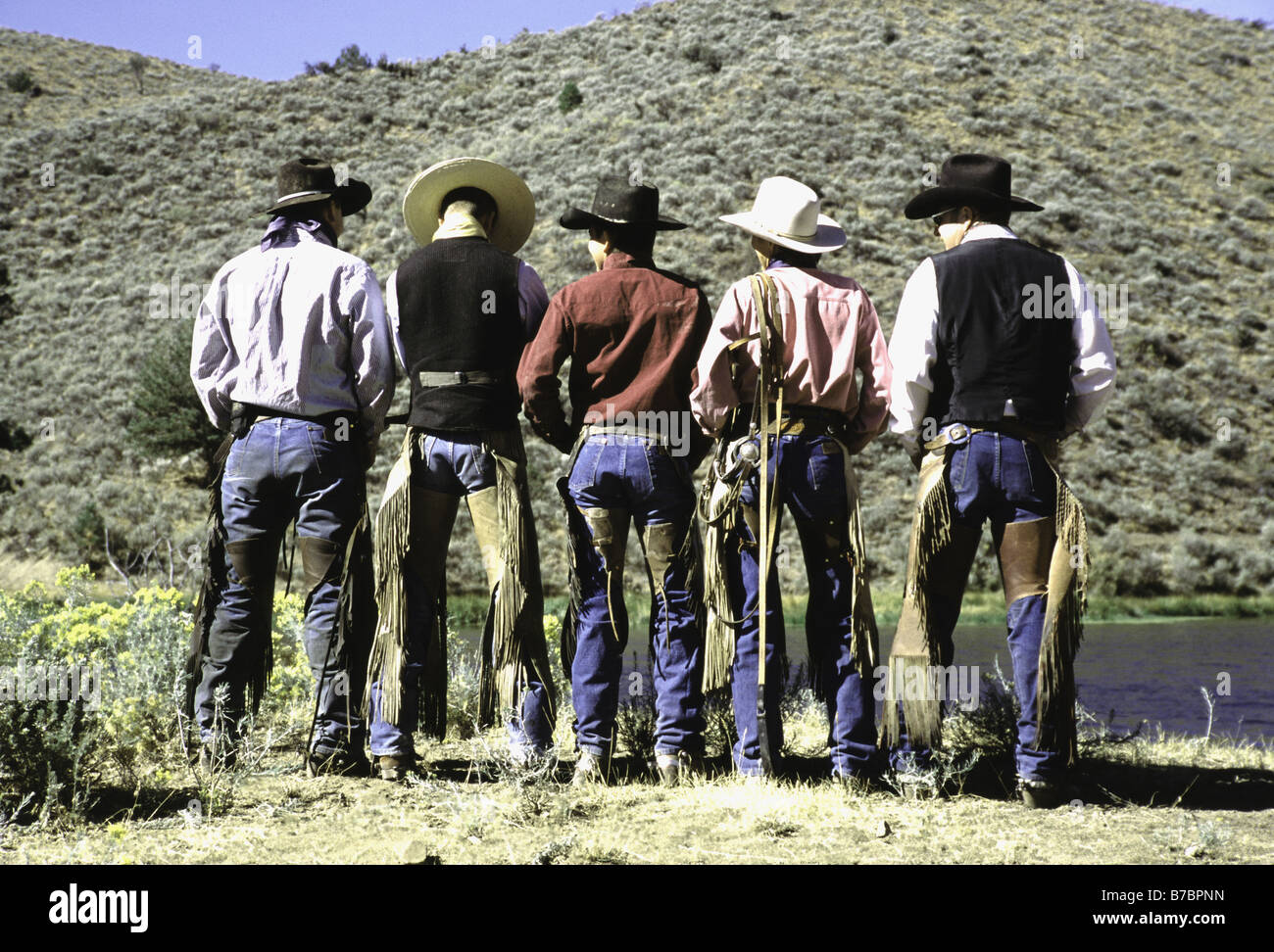 Five cowboys posing with their backsides in Oregon Stock Photo - Alamy