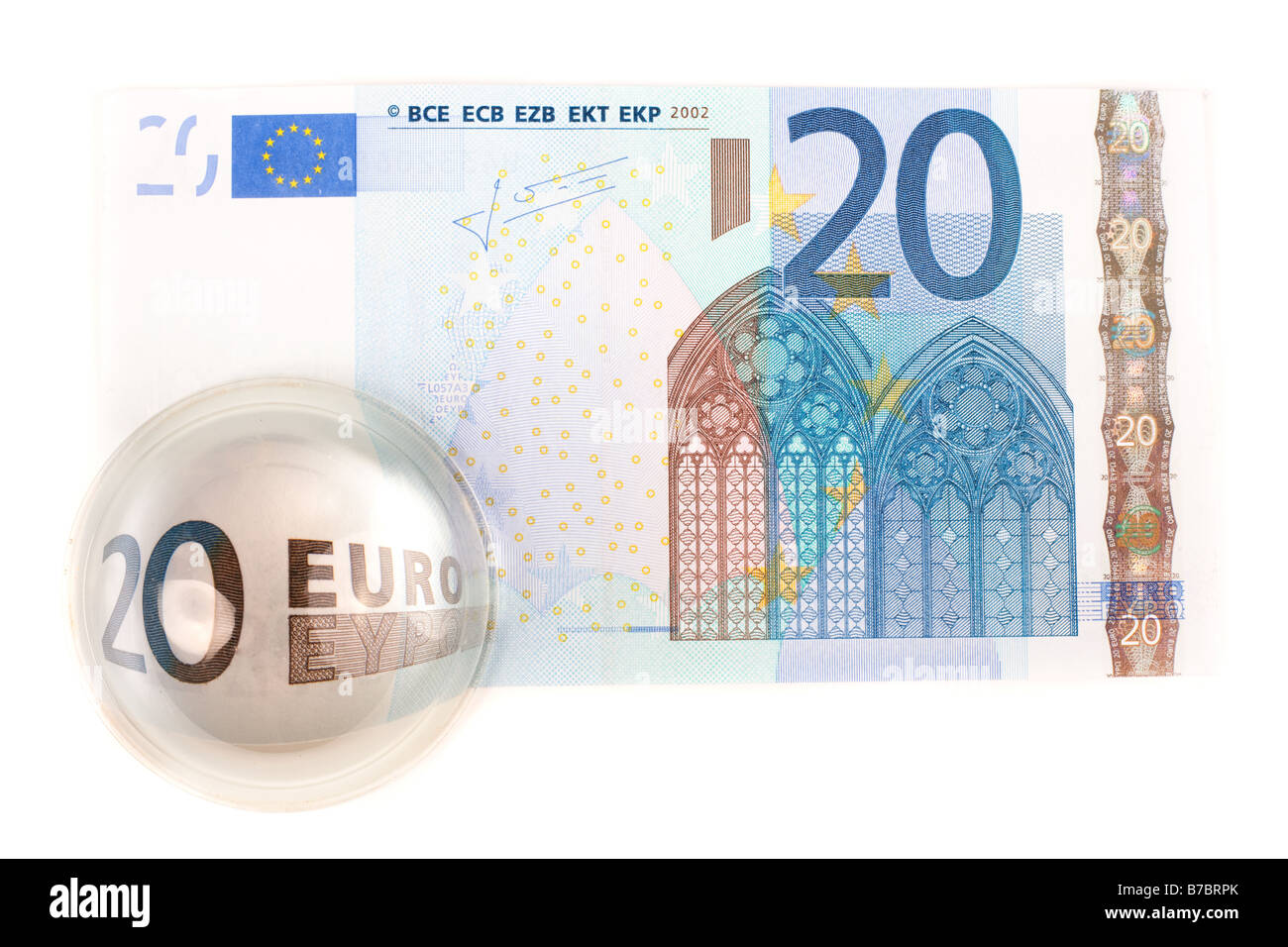 twenty euro bank note with magnifying glass Stock Photo - Alamy