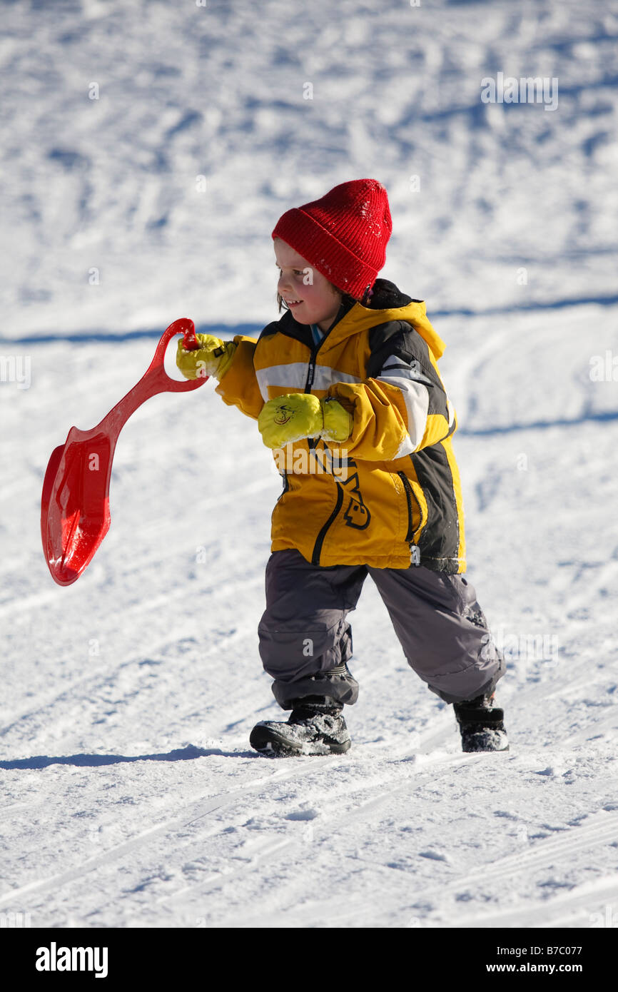having fun with tobogganing Stock Photo - Alamy