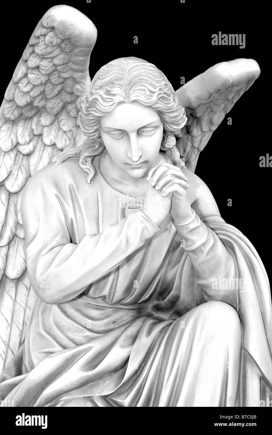 Cemetery angel with hands clasped Stock Photo - Alamy
