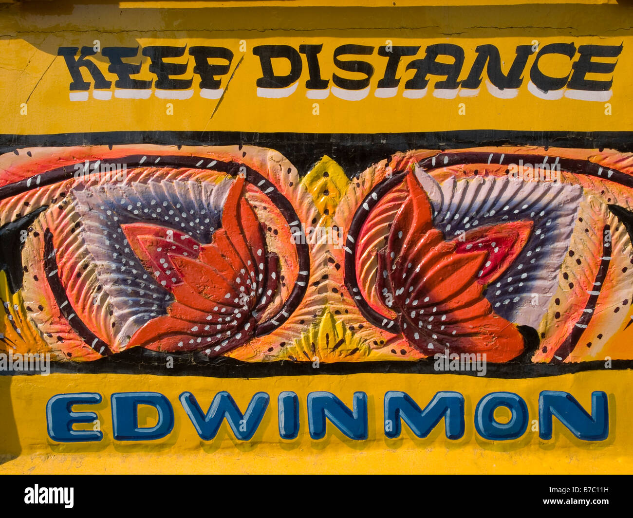 the carved and gaily-painted tailboard of an owner-driver lorry in ...