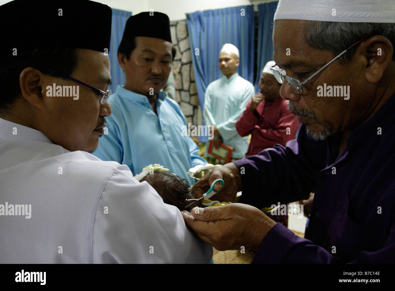 Malay custom of cutting hair of a new born baby in Terengganu, Malaysia ...