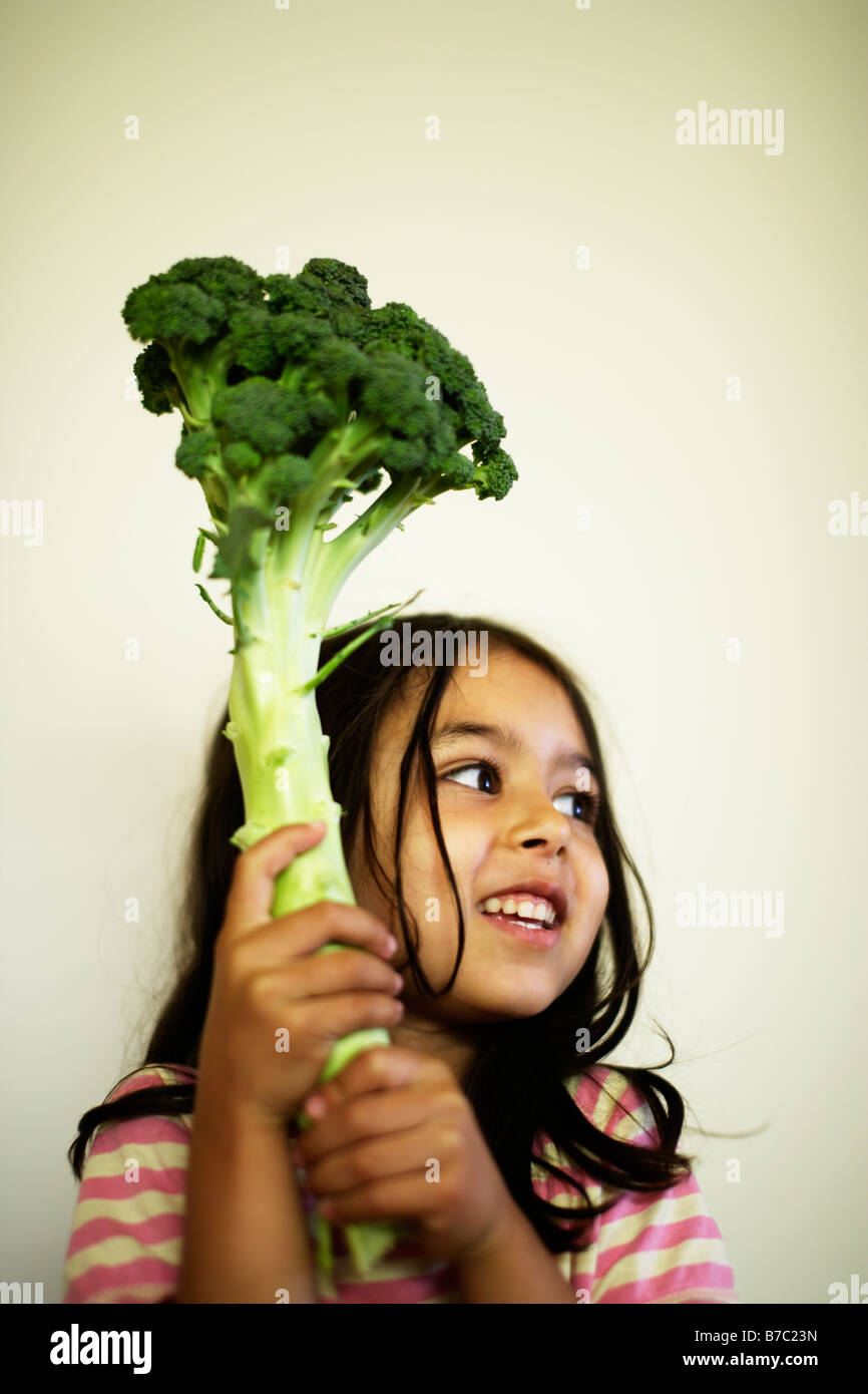 Five year old girl with Broccoli Stock Photo - Alamy