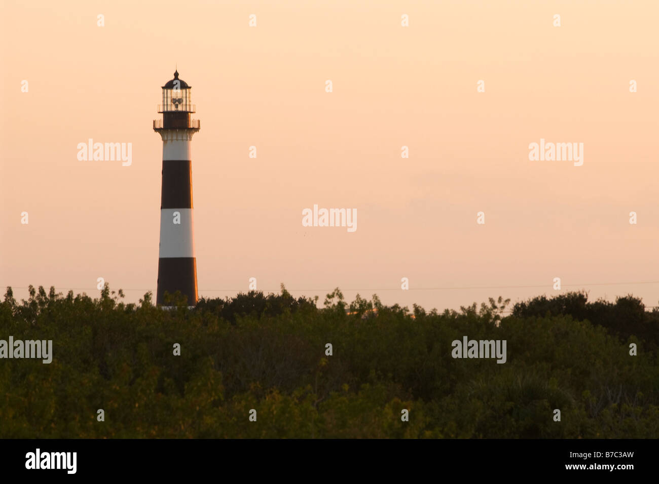 The sun sets near the Cape Canaveral Lighthouse, in Cape Canaveral ...