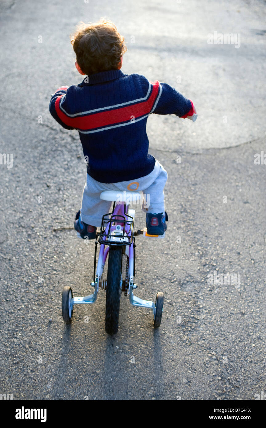 young boy riding his bikes Stock Photo - Alamy