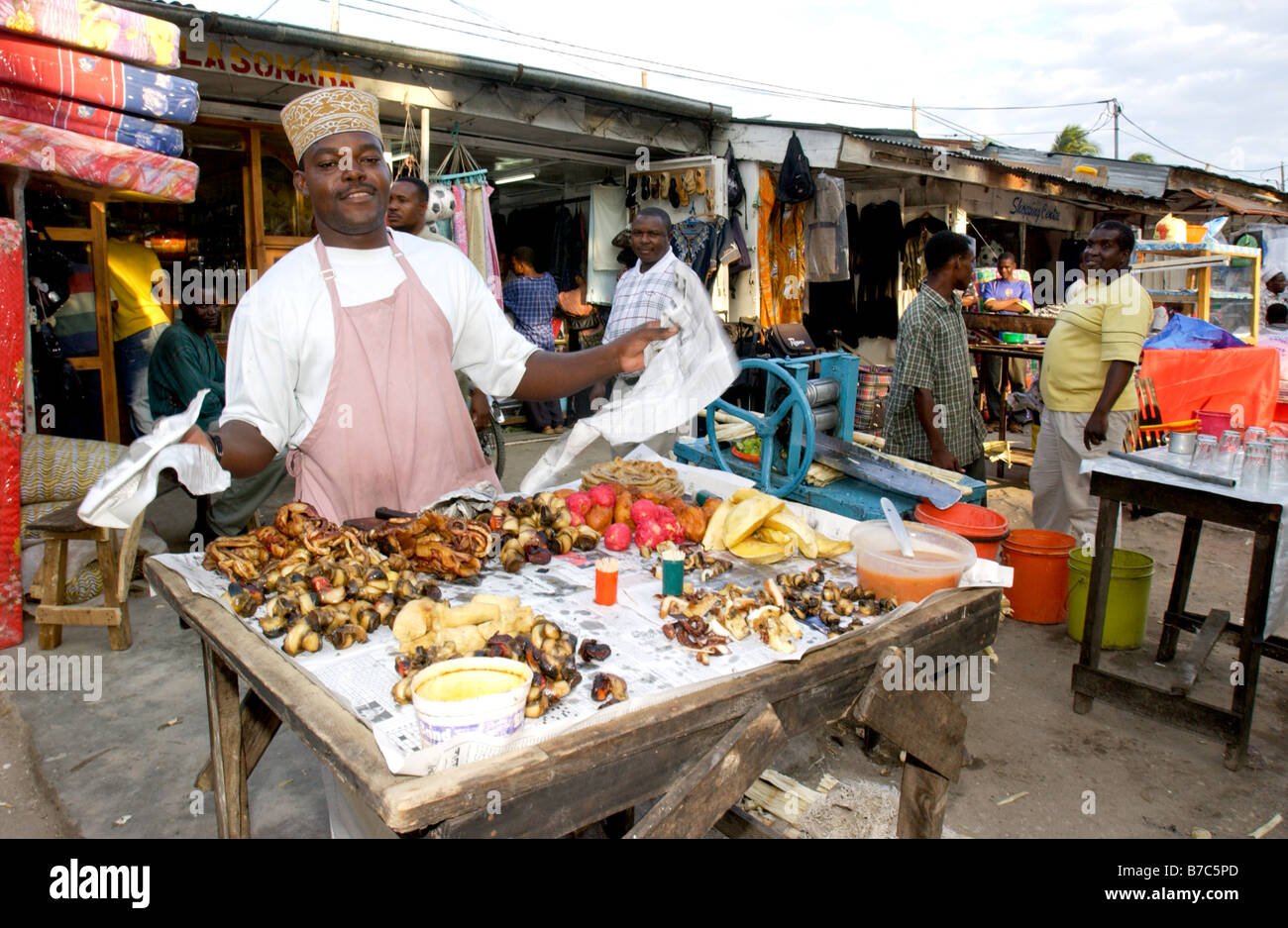 Man selling at a food stall Stock Photo - Alamy