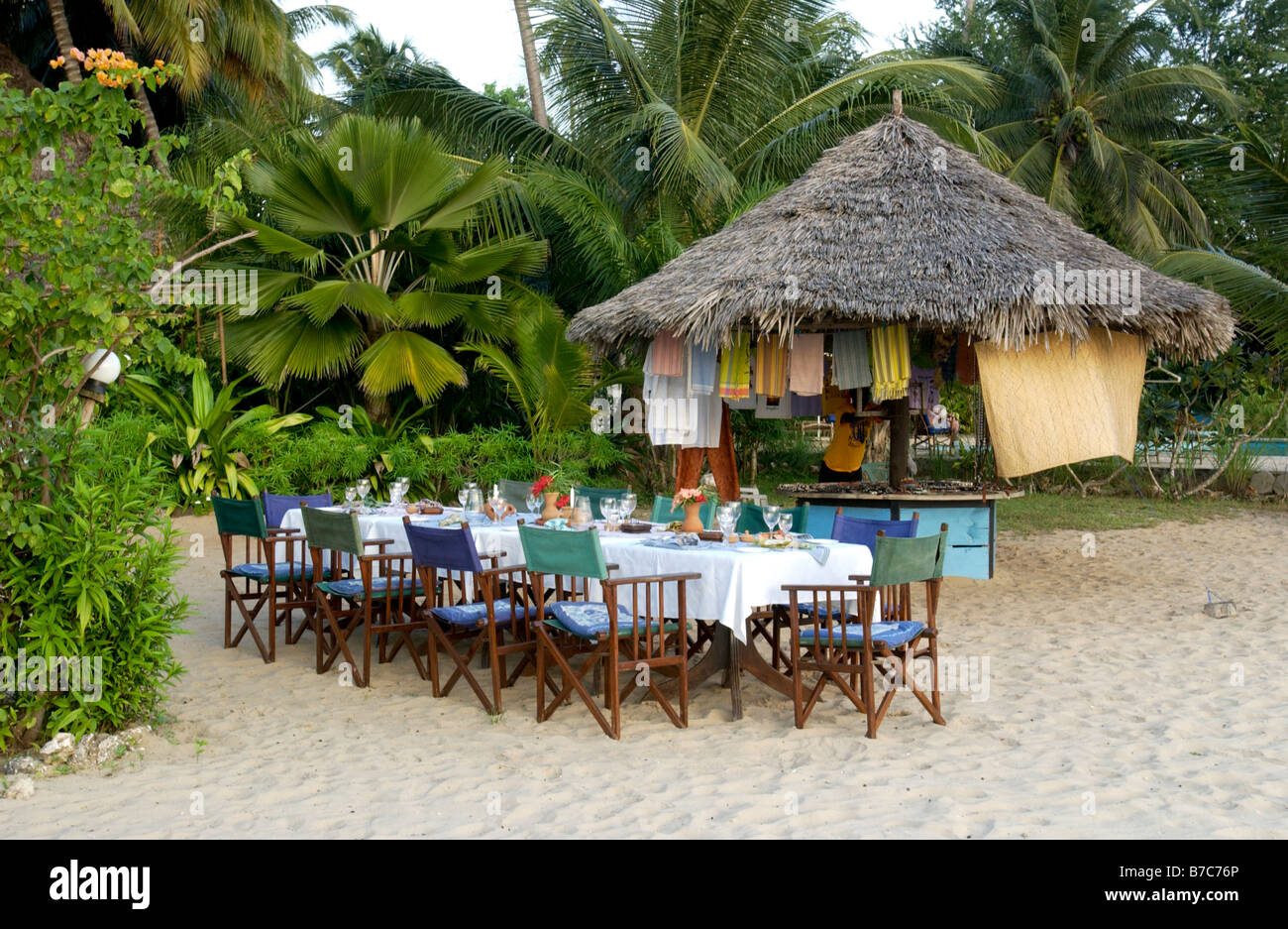 large table setting on the beach Stock Photo - Alamy