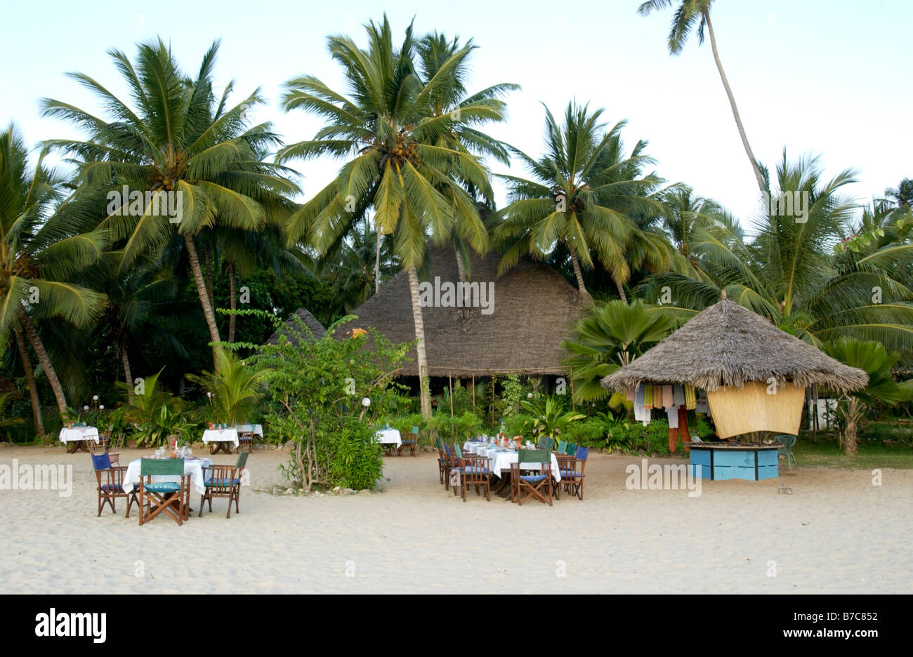 Tables set for lunch on Zanzibar beach Stock Photo - Alamy