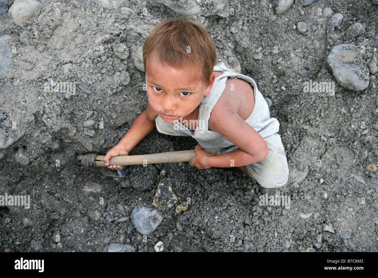 “Three year old Ashok useing a pick Nepal” Stock Photo - Alamy