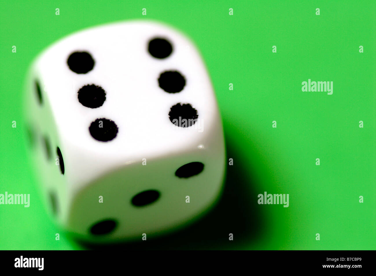 Dice rolled for six close up Stock Photo - Alamy