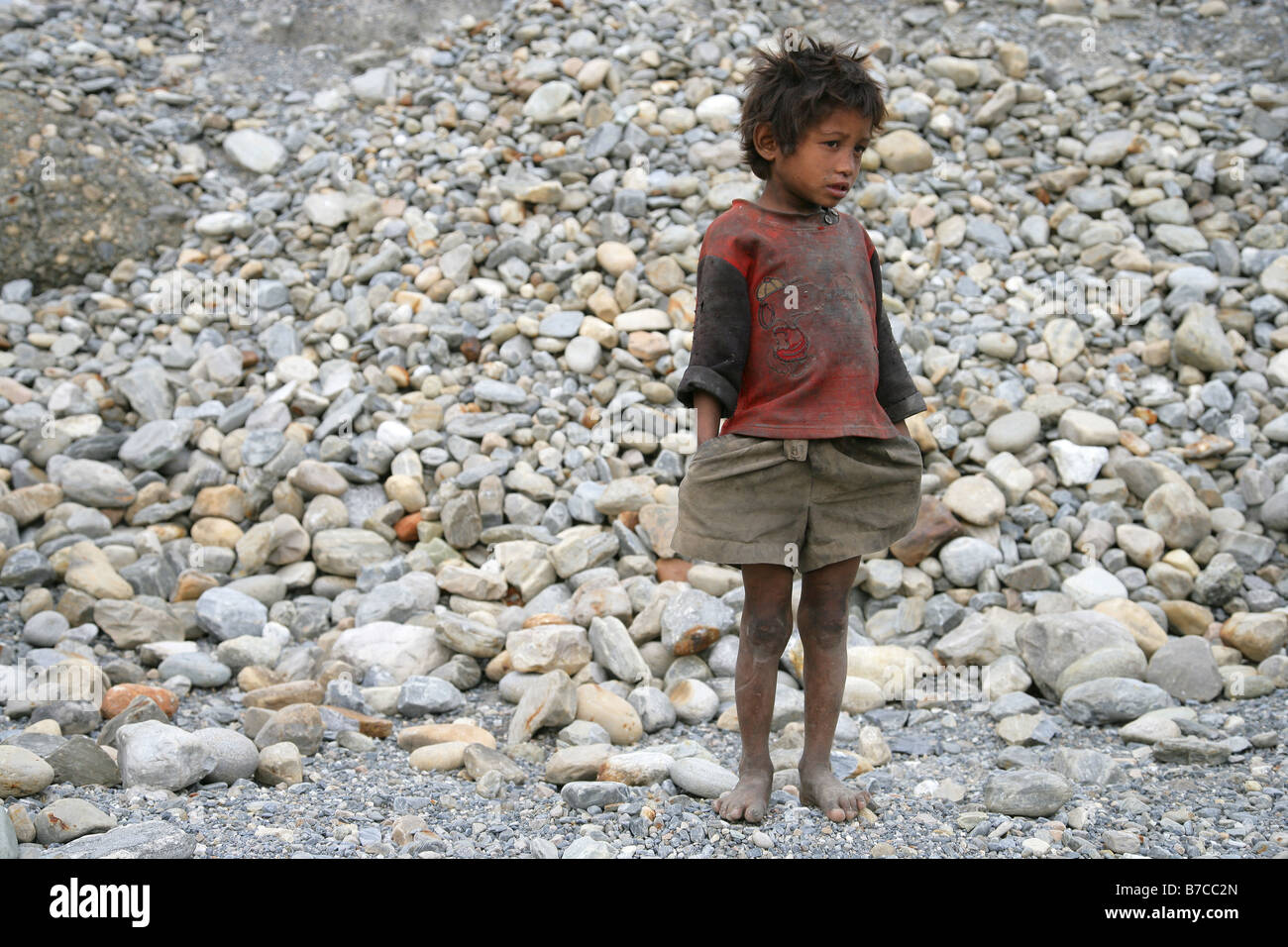 “Small nepali boy wearing filthy clothes” Stock Photo - Alamy