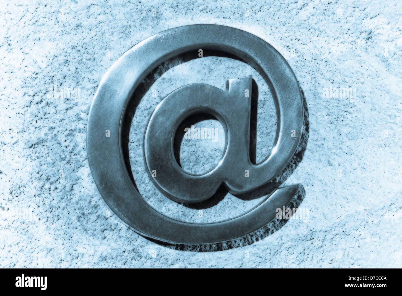 internet 'at' sign/symbol on a slab of stone Stock Photo - Alamy