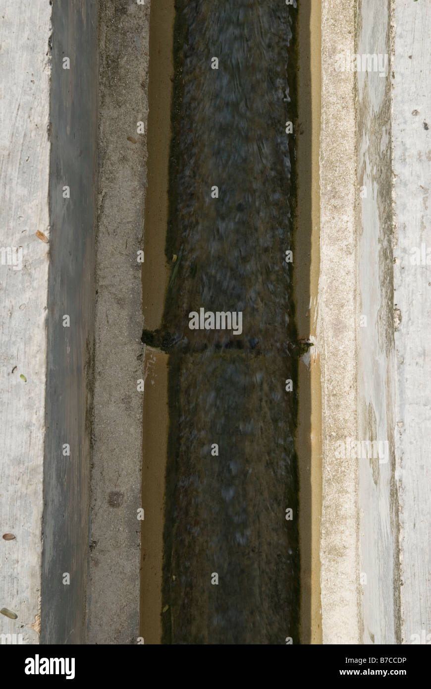 Flowing water in an open storm water drain Stock Photo - Alamy