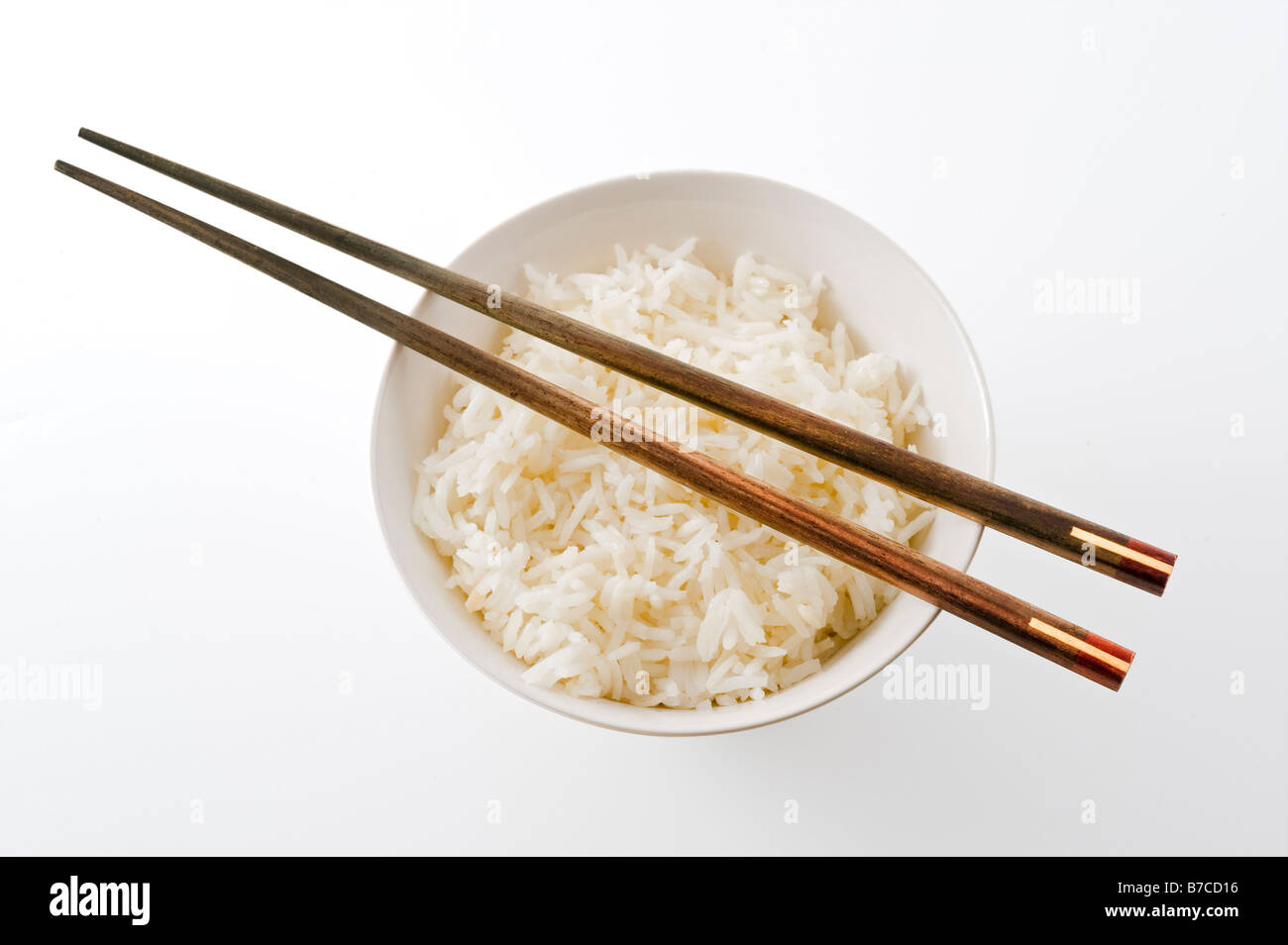 plain rice bowl with chopsticks from above isolated on on white Stock ...