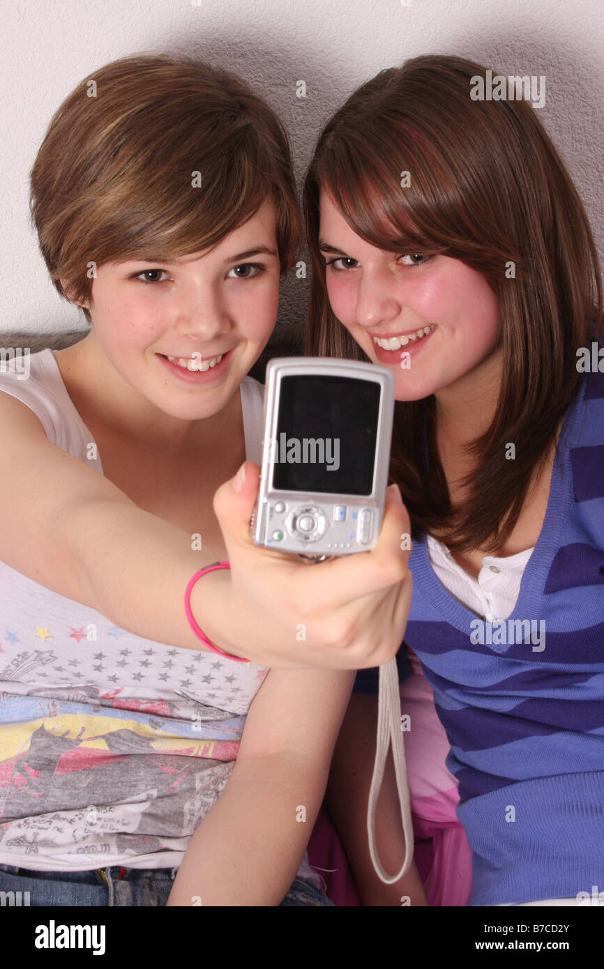 Two teenage girls taking a photo of themselves Stock Photo - Alamy