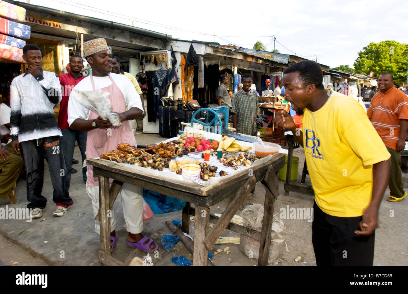 Man selling at a food stall Stock Photo - Alamy