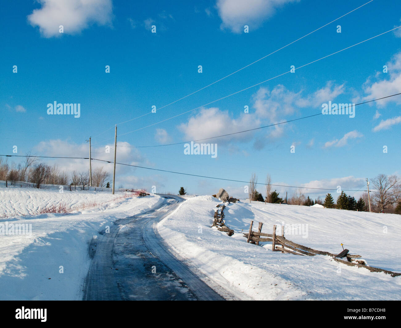Country lane with snow in winter in New Brunswick Canada Stock Photo ...