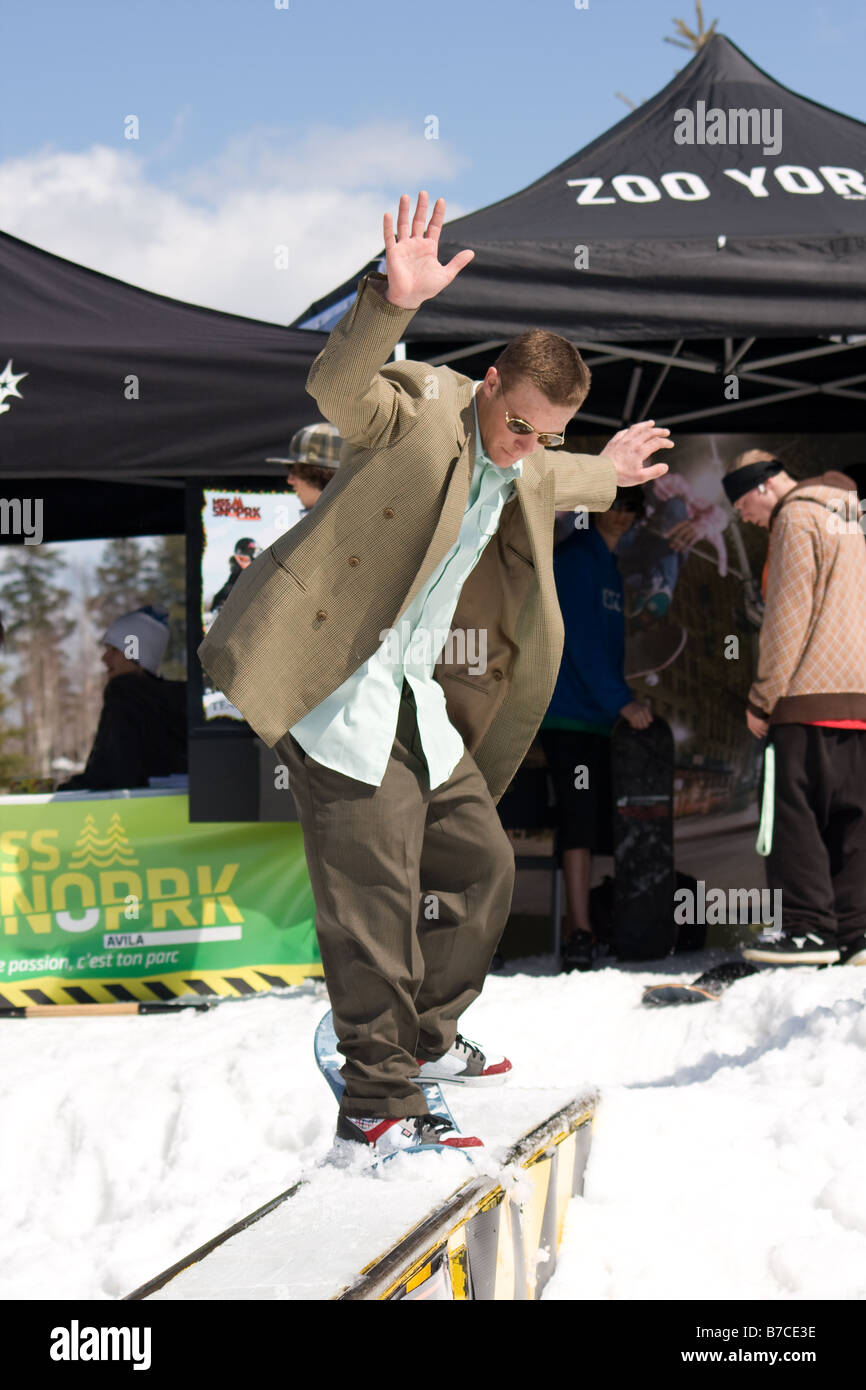 Man in suit snowboarding on a Ramp Stock Photo - Alamy
