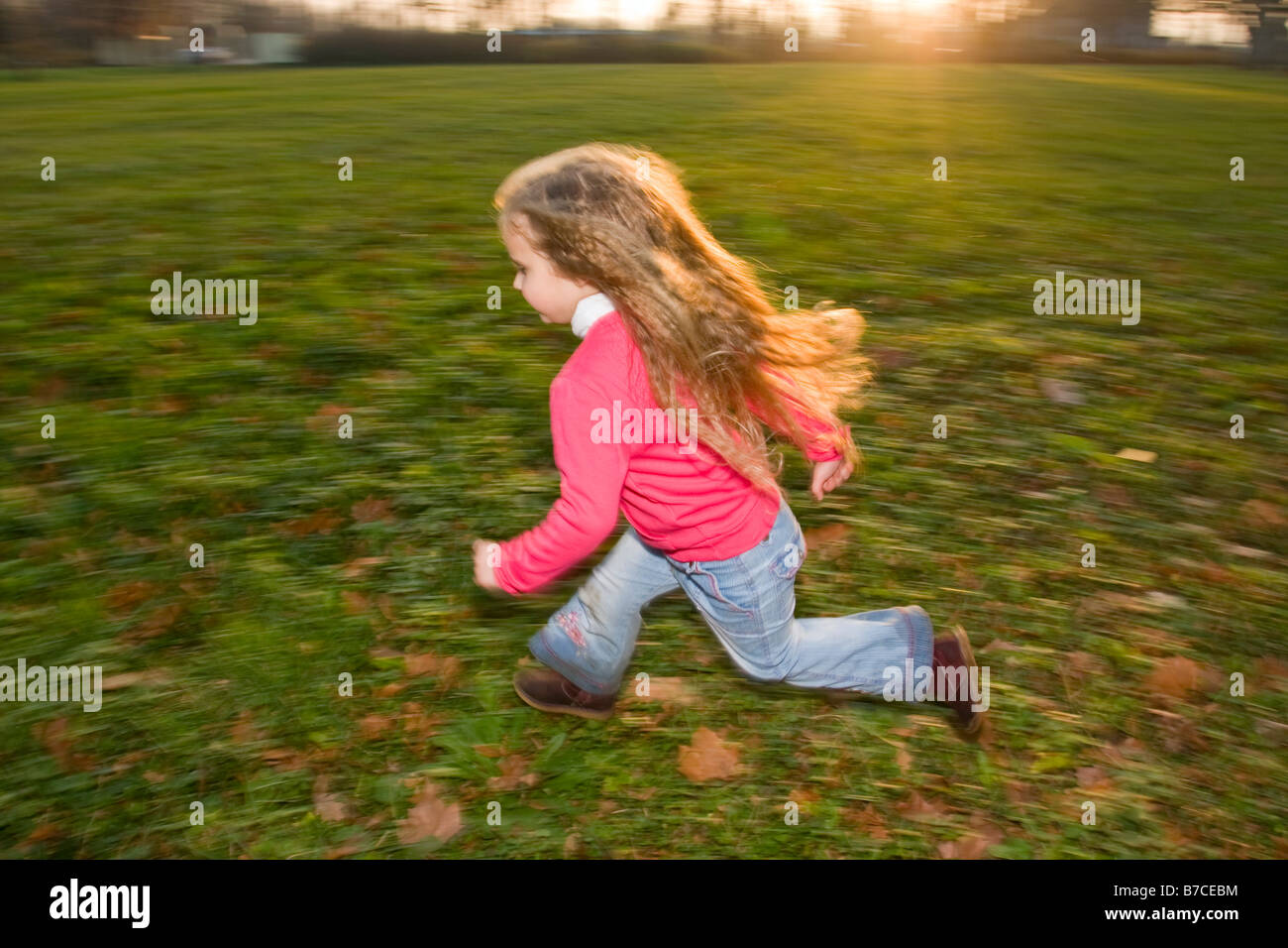 Running baby girl 4 years Stock Photo - Alamy