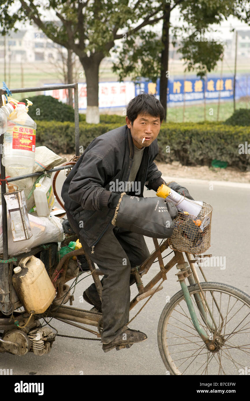man on bike china changahi Stock Photo - Alamy