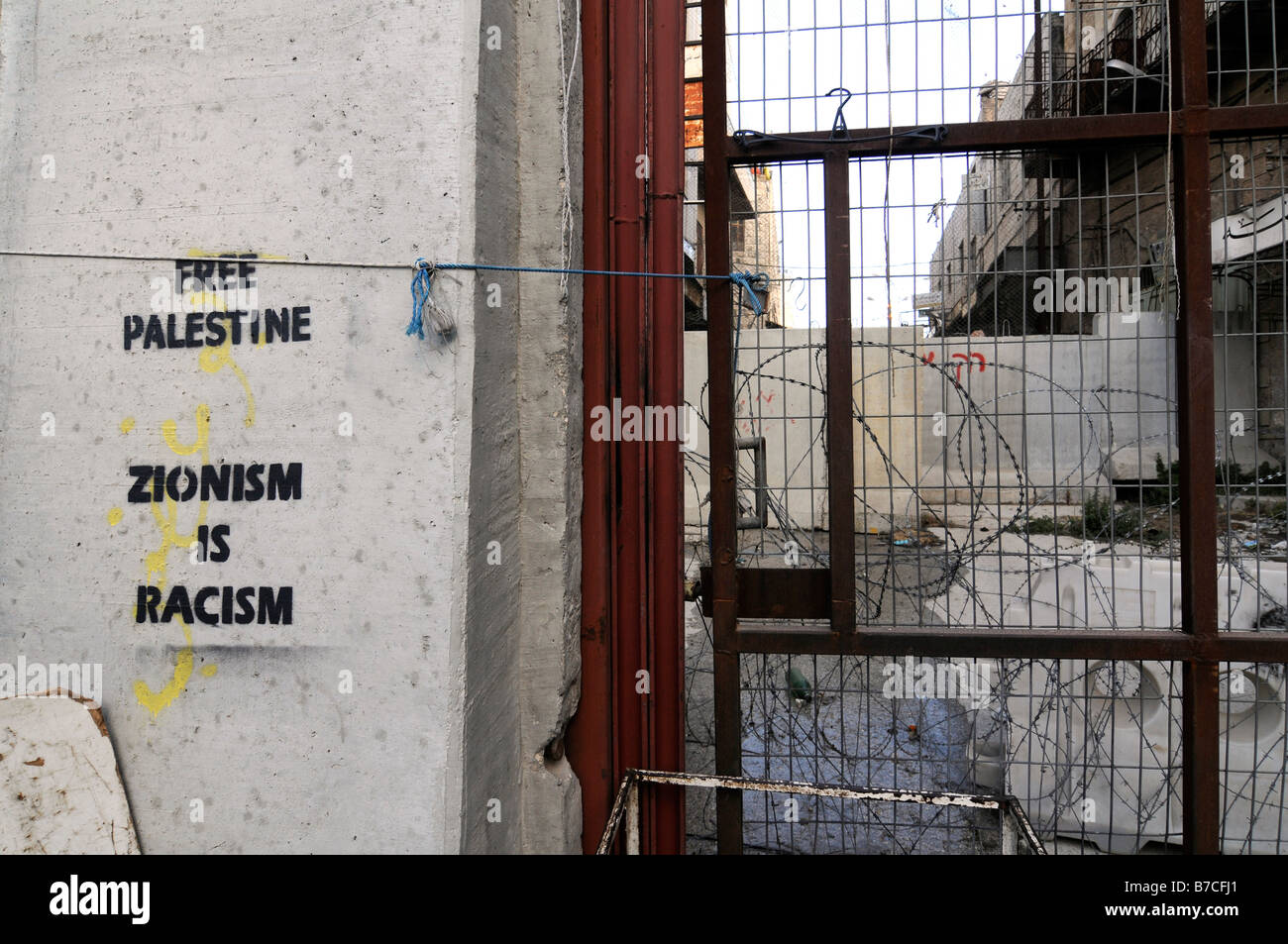 Street scene in Hebron under Israeli occupation: a fence dividing the ...